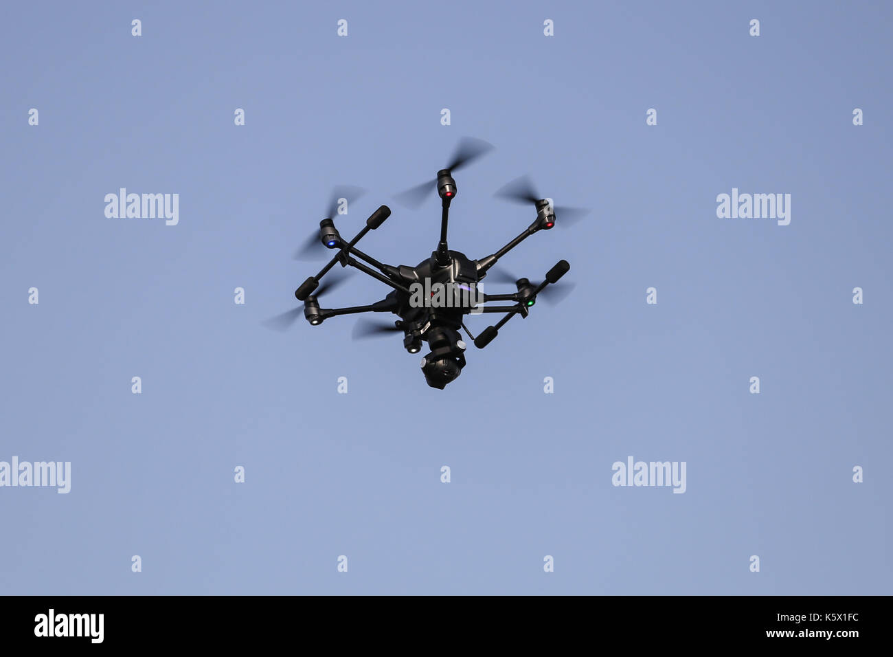 Black hexacopter helicopter is flying in sky Stock Photo - Alamy