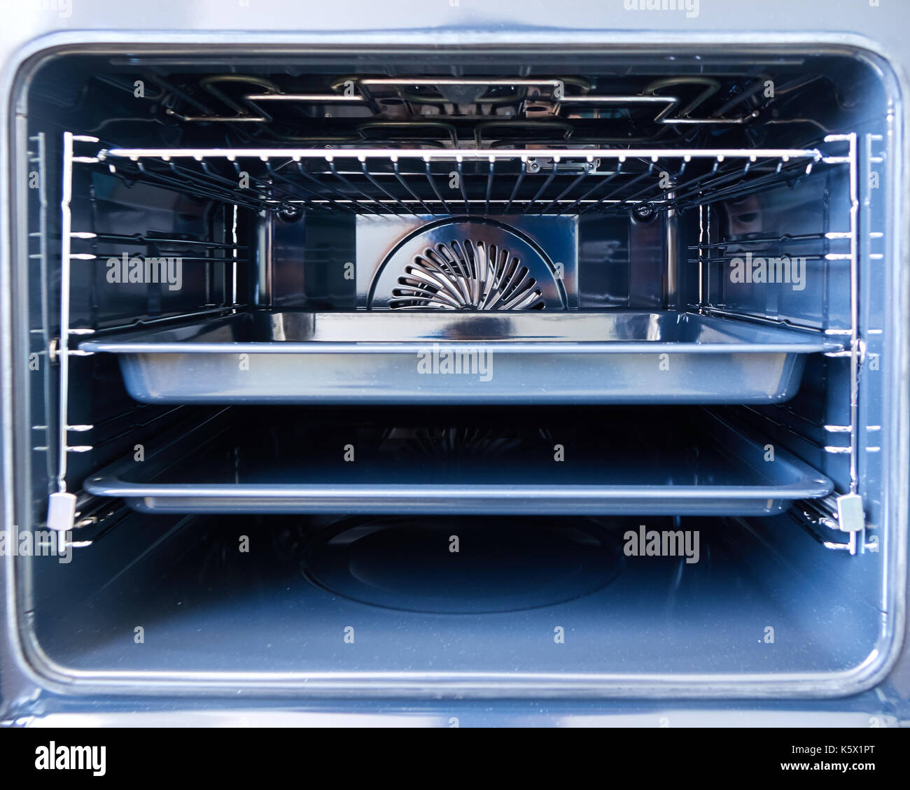 Modern oven with tray inside Stock Photo - Alamy