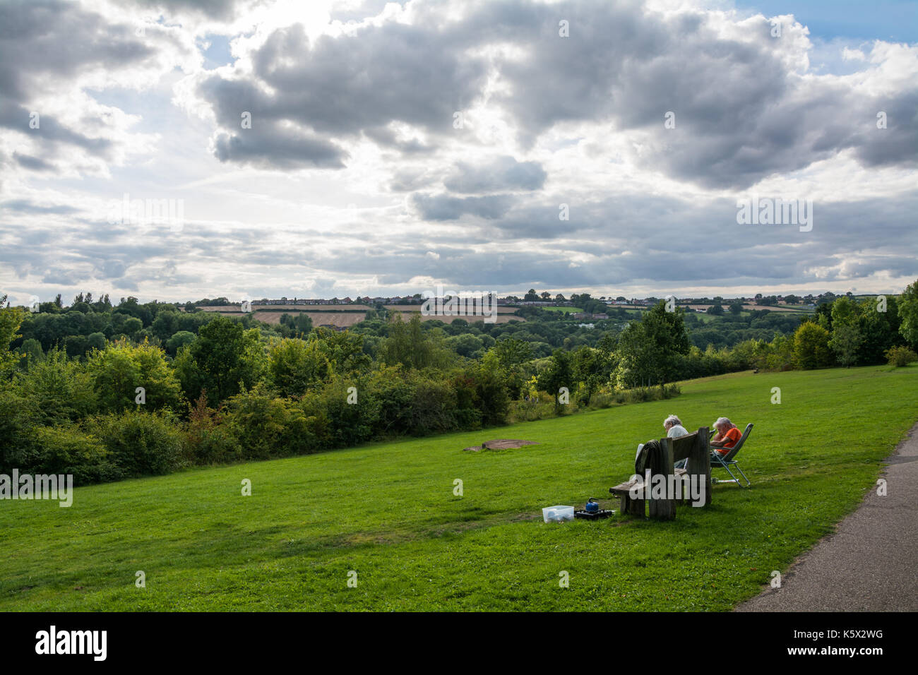 A view overlooking the Severn Valley. An elderly couple relaxing ...