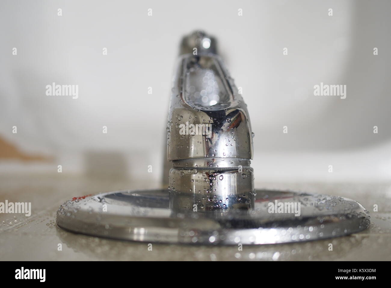 Top-down shot of a chrome shower faucet (tap) with water droplets Stock ...