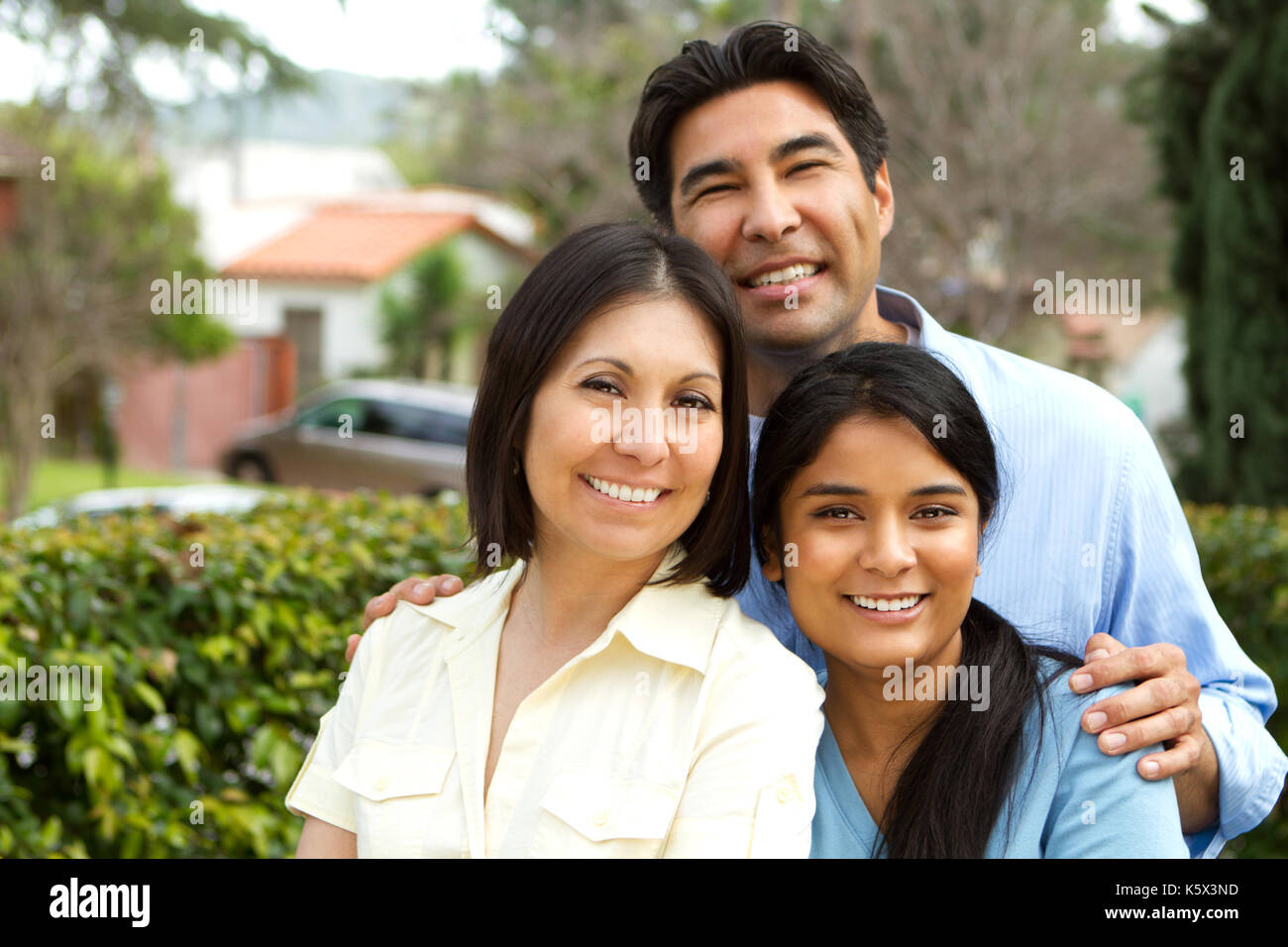 Hispanic family with a teen daughter Stock Photo - Alamy