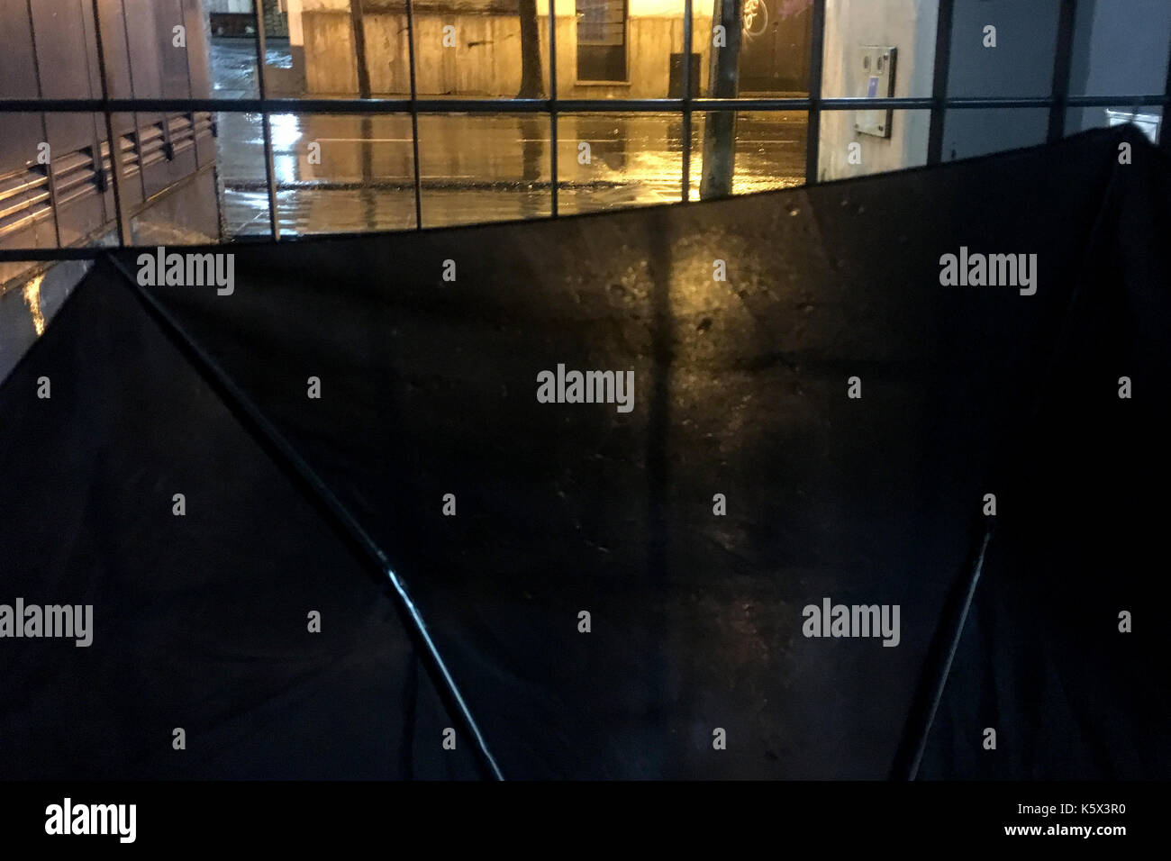Opening the umbrella in a rainny day Stock Photo - Alamy