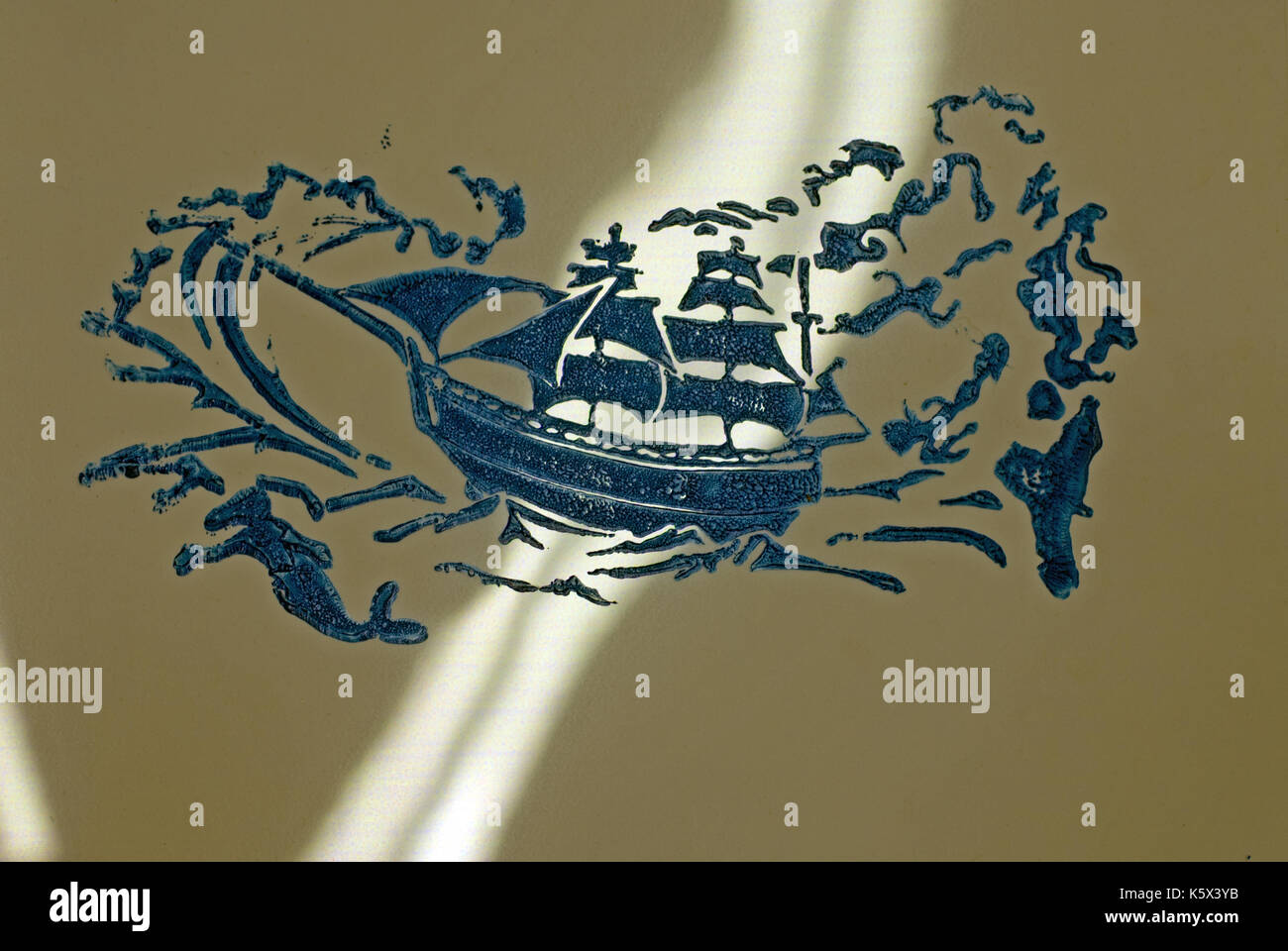 Block print image of a sailing ship between a heaving wave and heavy ...