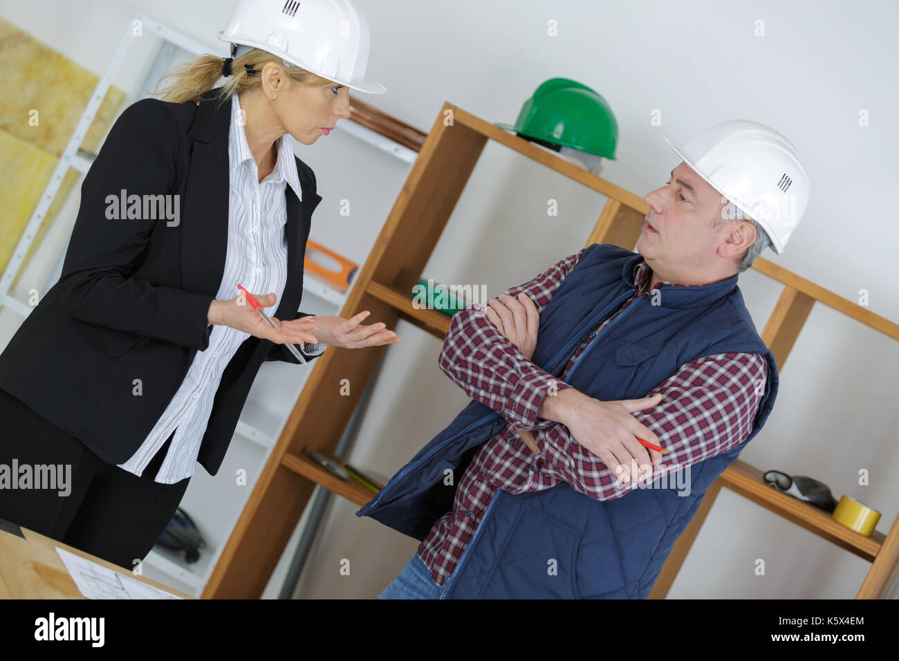 female foreman construction workers indoors Stock Photo - Alamy