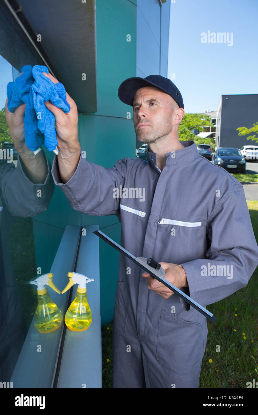 worker cleaning building window Stock Photo - Alamy