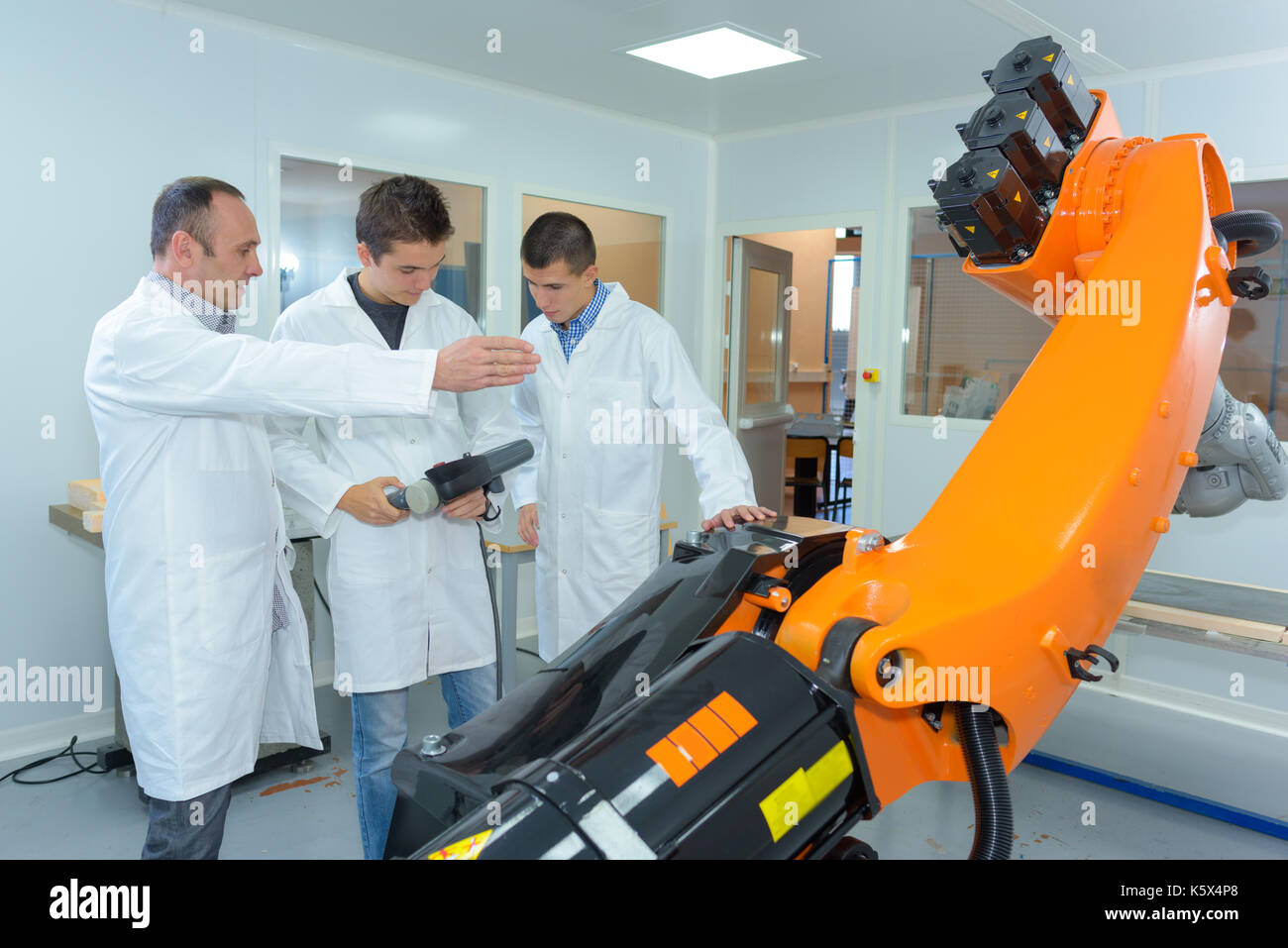 young smart students portrait in a robotic lab Stock Photo - Alamy