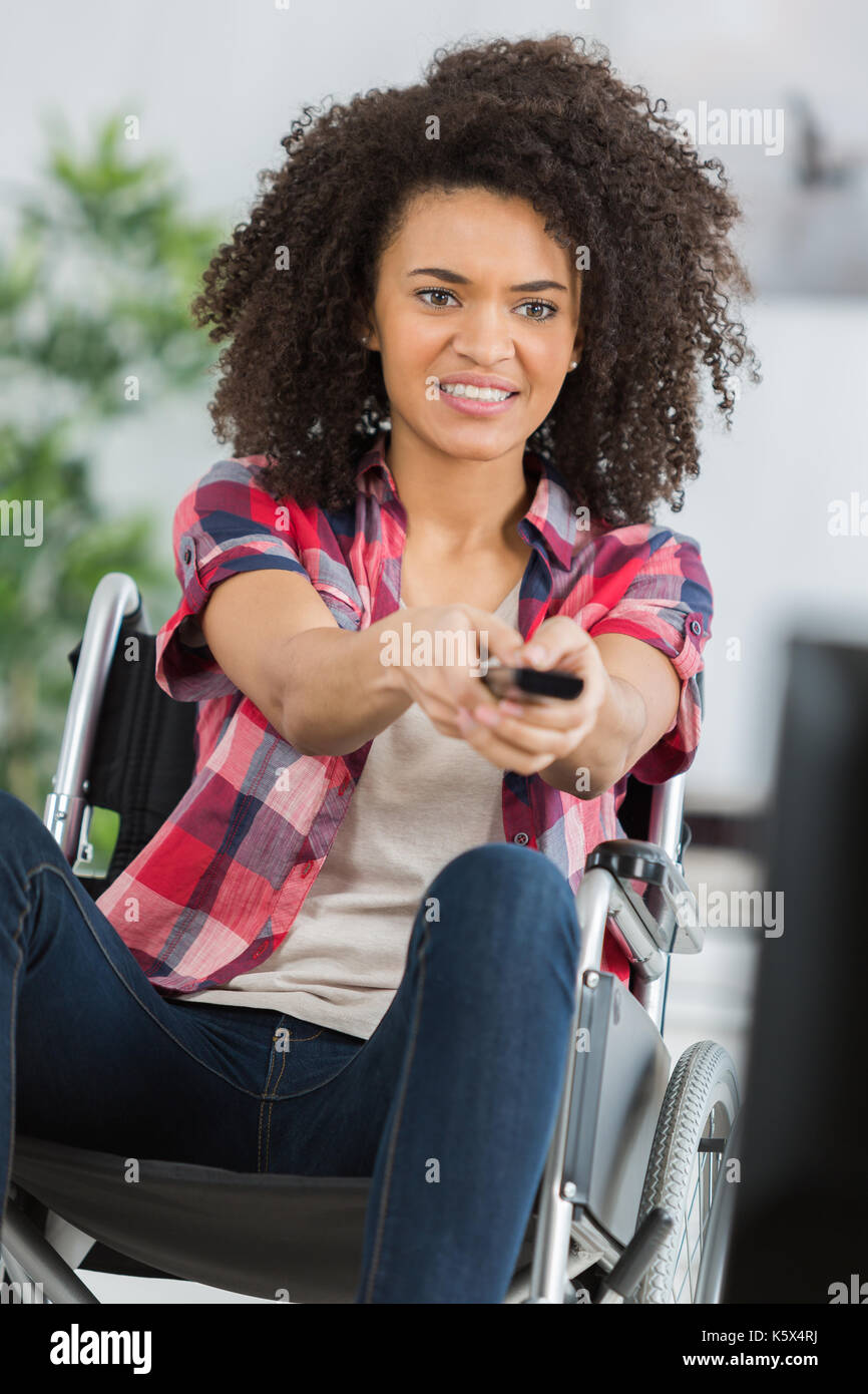 Old woman watching tv wheelchair hi-res stock photography and images ...