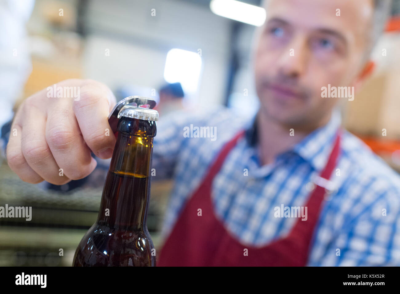 Man opening beer bottle hi-res stock photography and images - Alamy