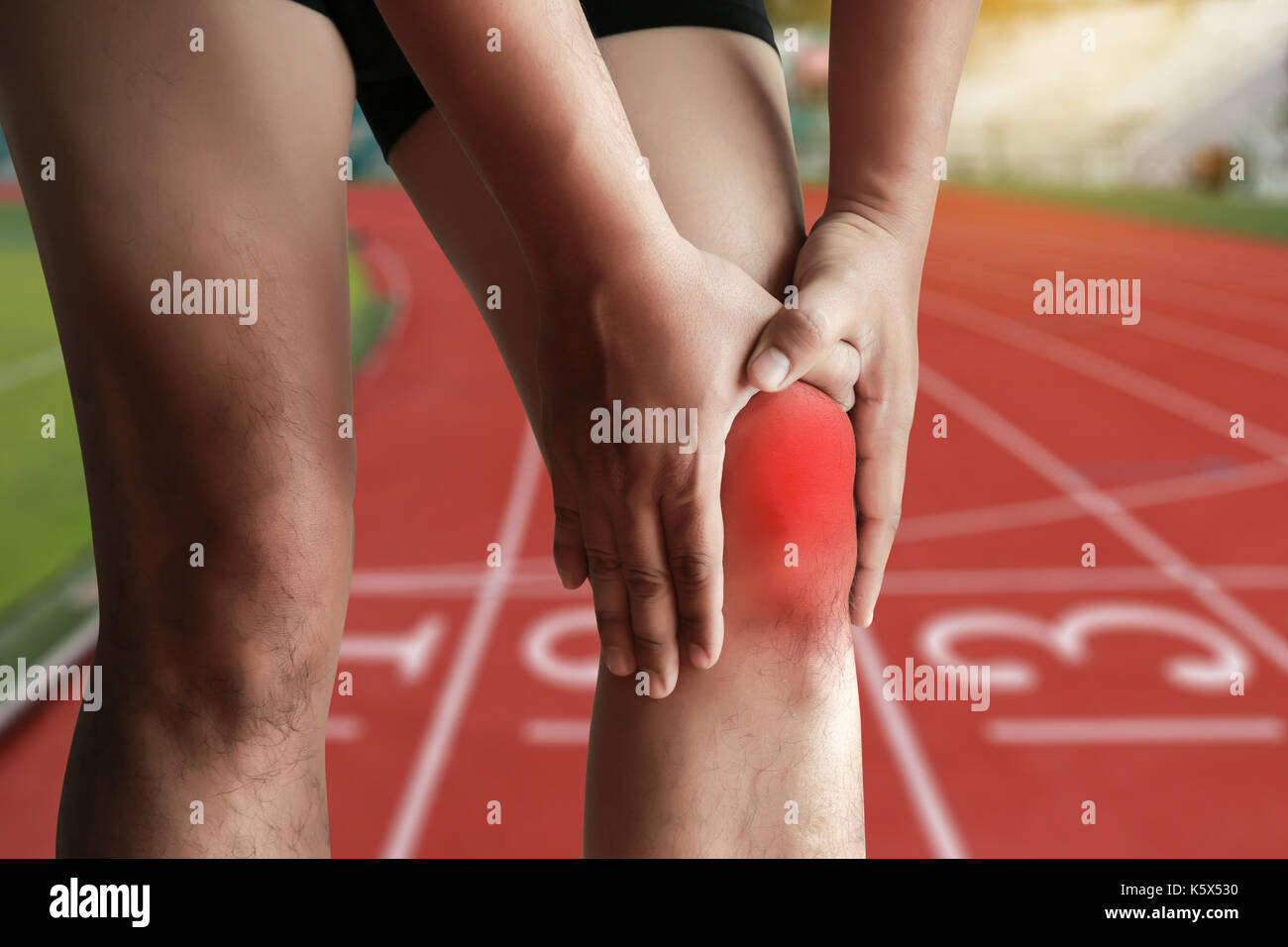 the knee man holds on suffering from pain in knee Closeup. The lesion ...