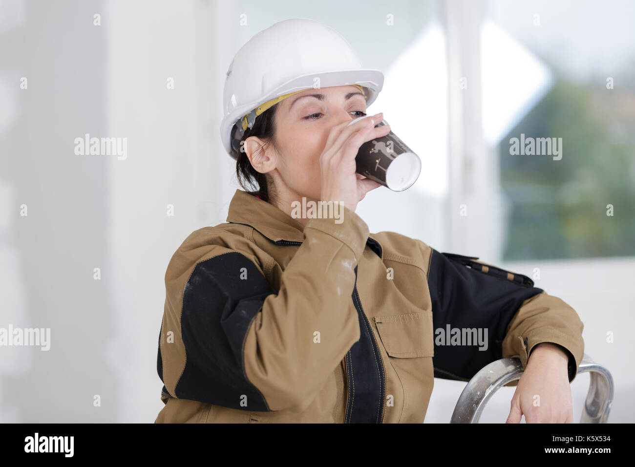 construction worker having a coffee break Stock Photo - Alamy