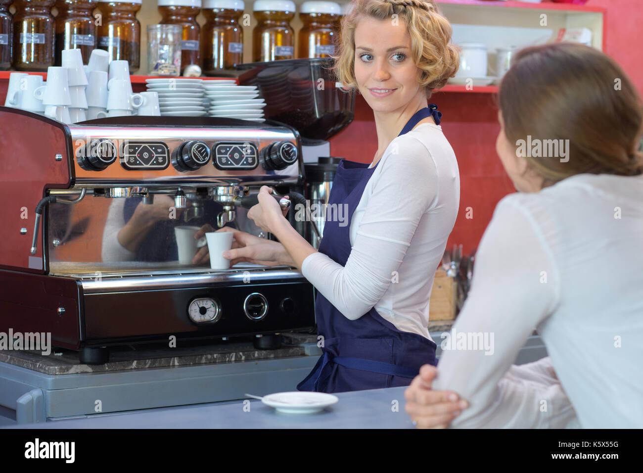 barista preparing coffee with machine in coffee shop Stock Photo - Alamy