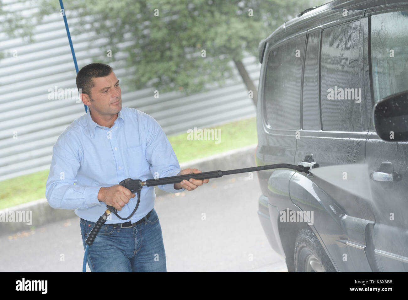 blue car washing on open air Stock Photo - Alamy