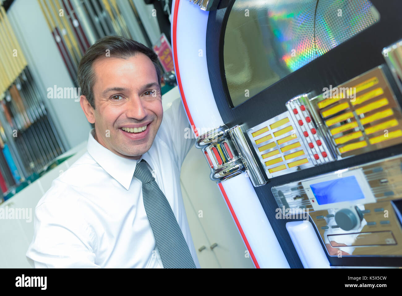 man next to juke box Stock Photo - Alamy