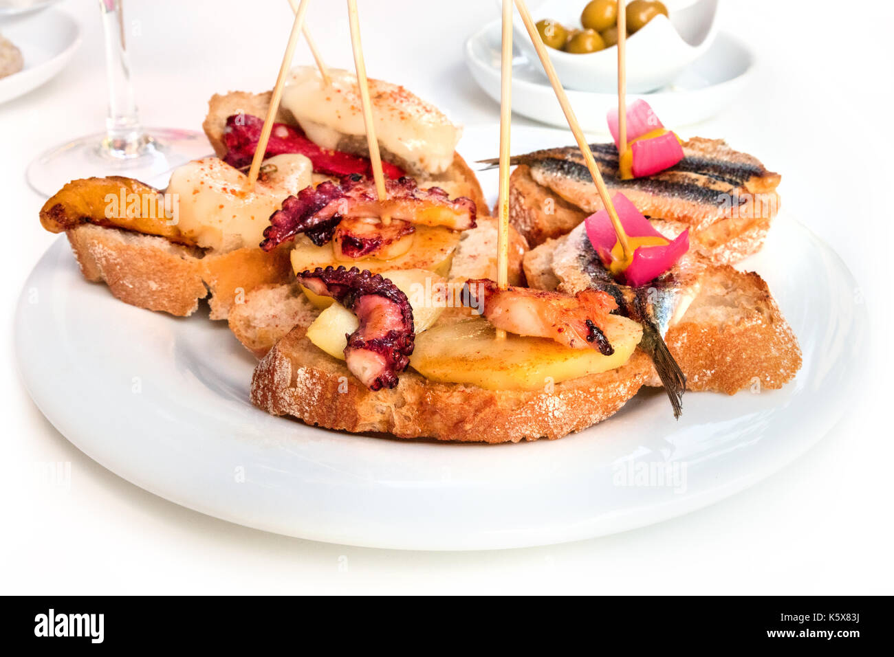Spanish seafood tapas on a white background Stock Photo - Alamy