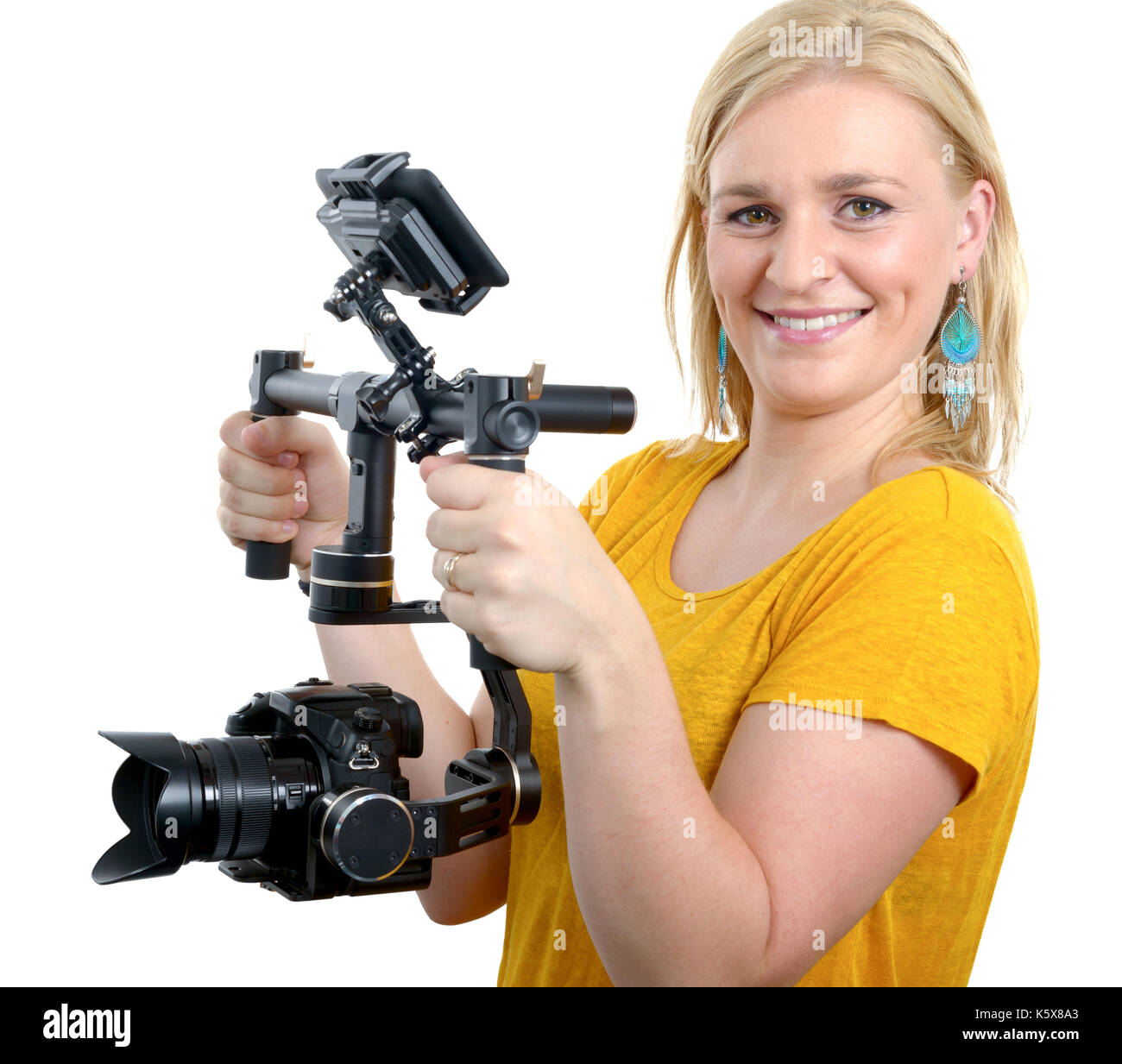 young woman videographer using steady cam, on white Stock Photo - Alamy