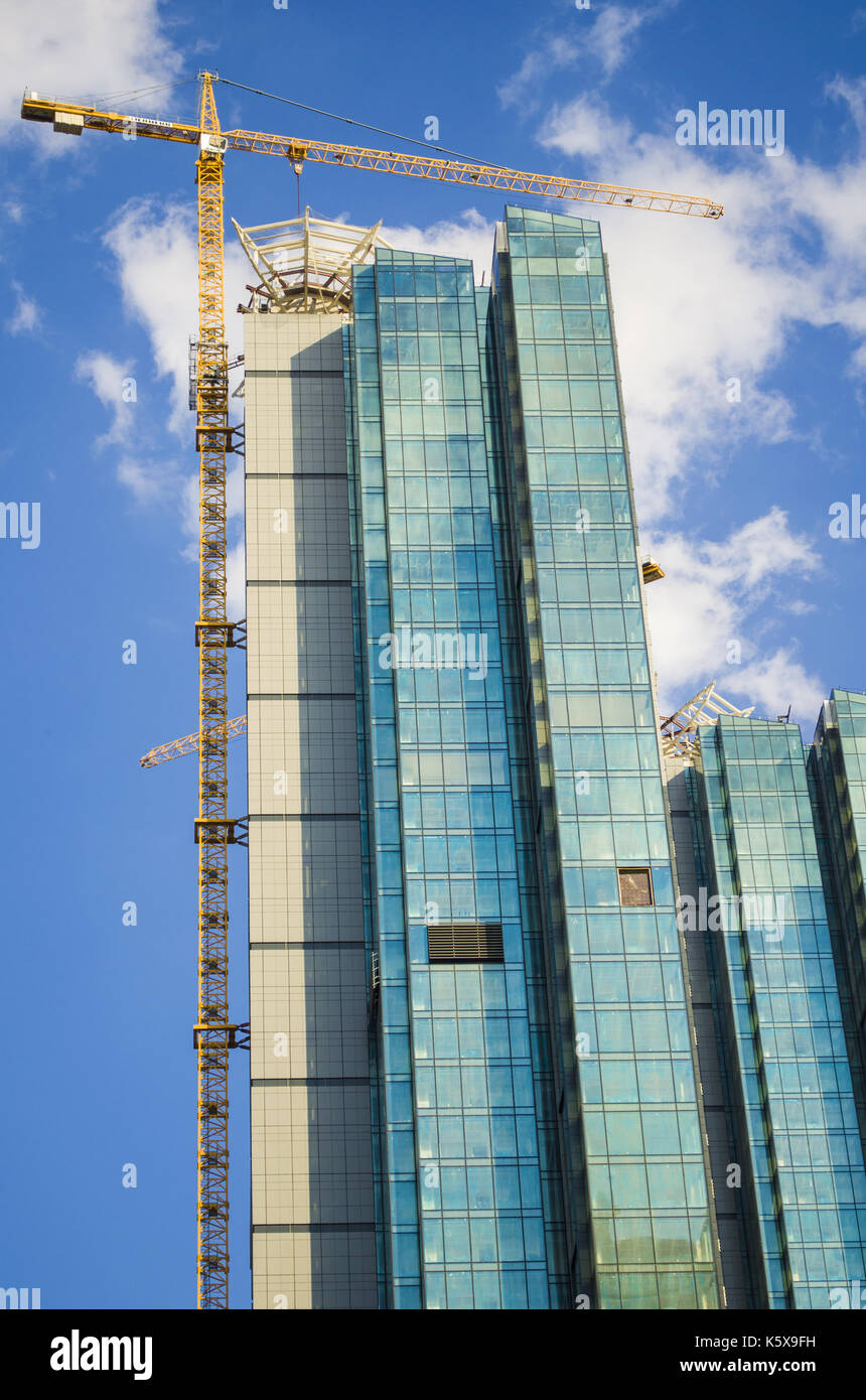 sky-scrapers building cranes Stock Photo - Alamy