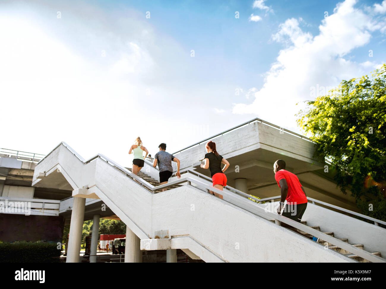 Black man running up stairs hi-res stock photography and images - Alamy