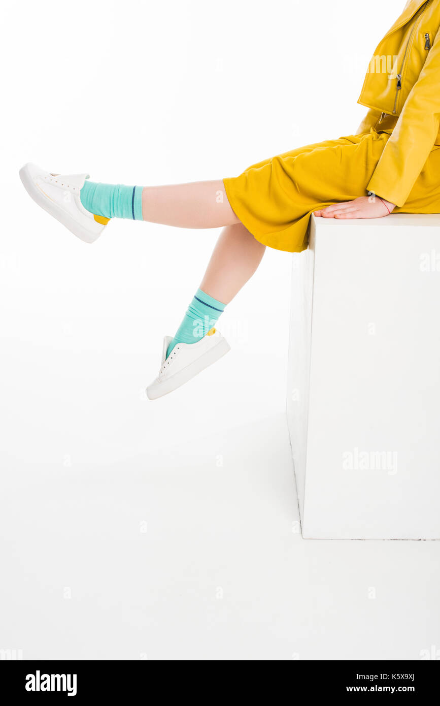 girl dressed in yellow with turqouise socks Stock Photo - Alamy