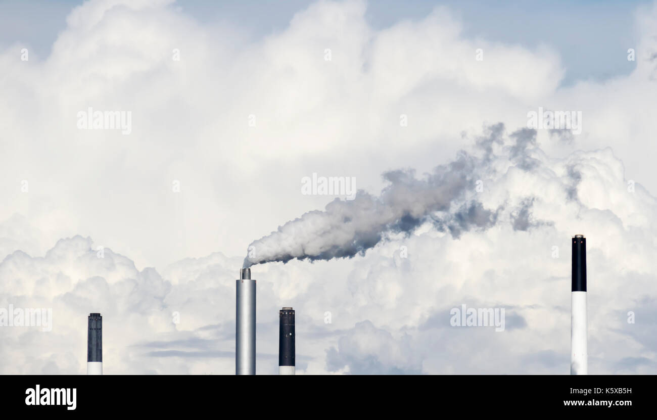 Smoke coming out of the factory pipes Stock Photo - Alamy
