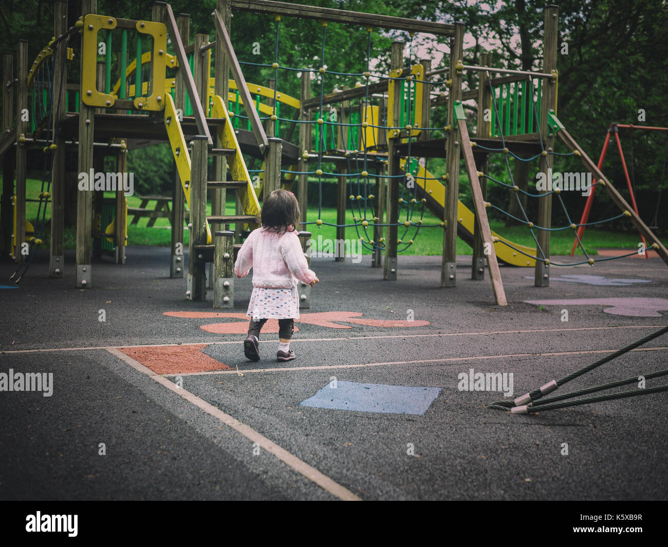 baby girl playing in the playground Stock Photo - Alamy