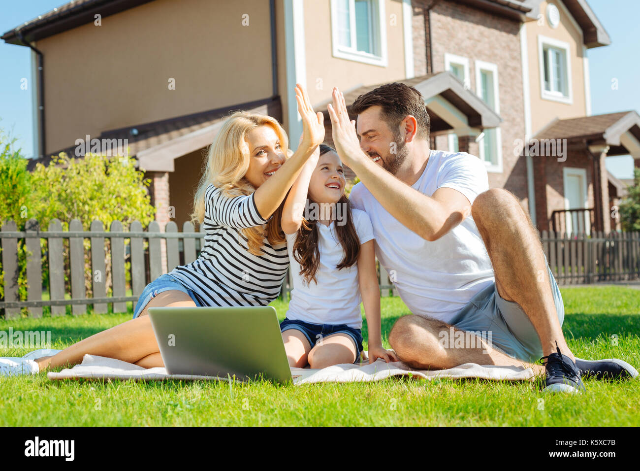 Parents high five child hi-res stock photography and images - Alamy