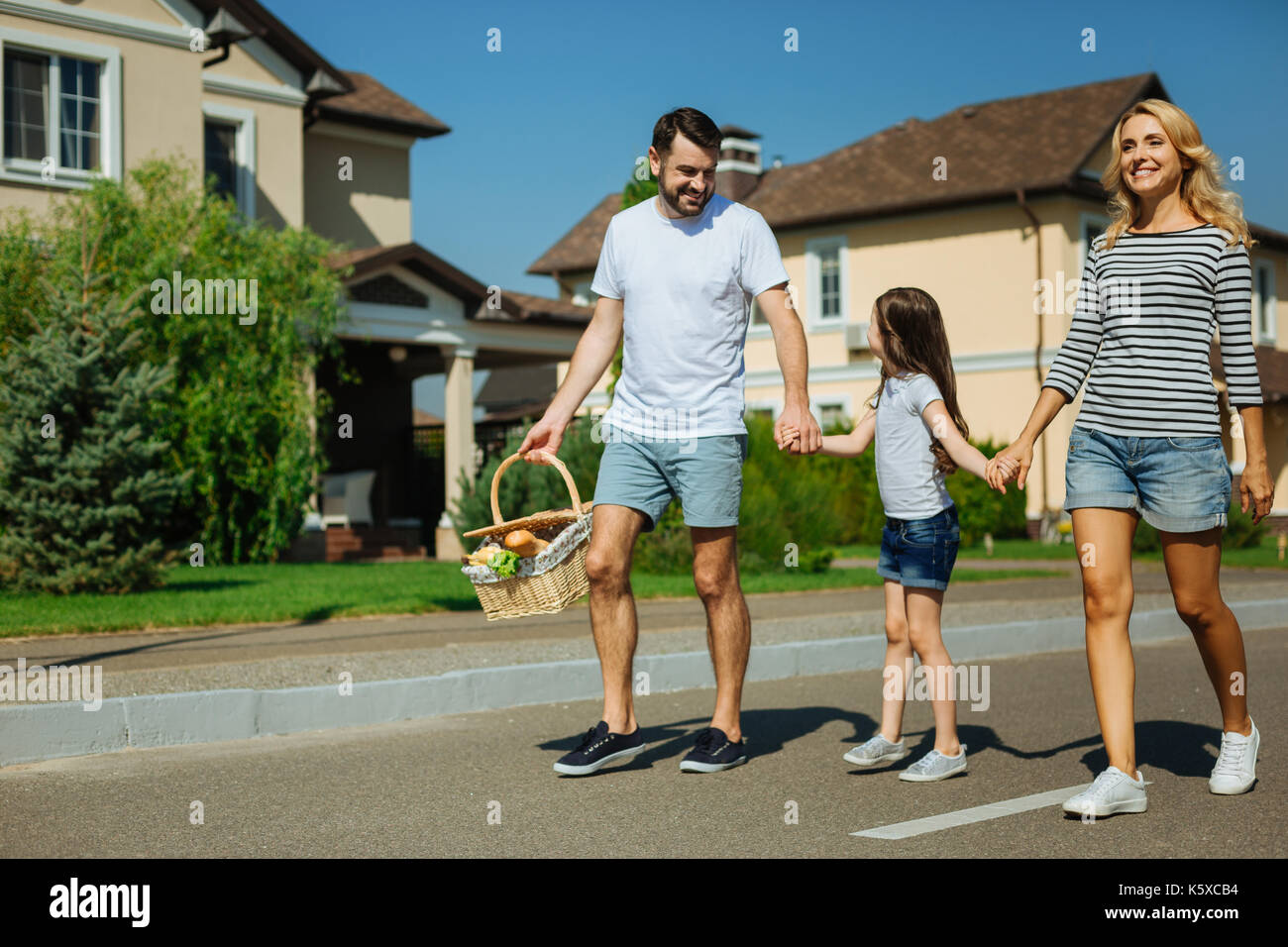 Pleasant cheerful family going on a picnic together Stock Photo - Alamy