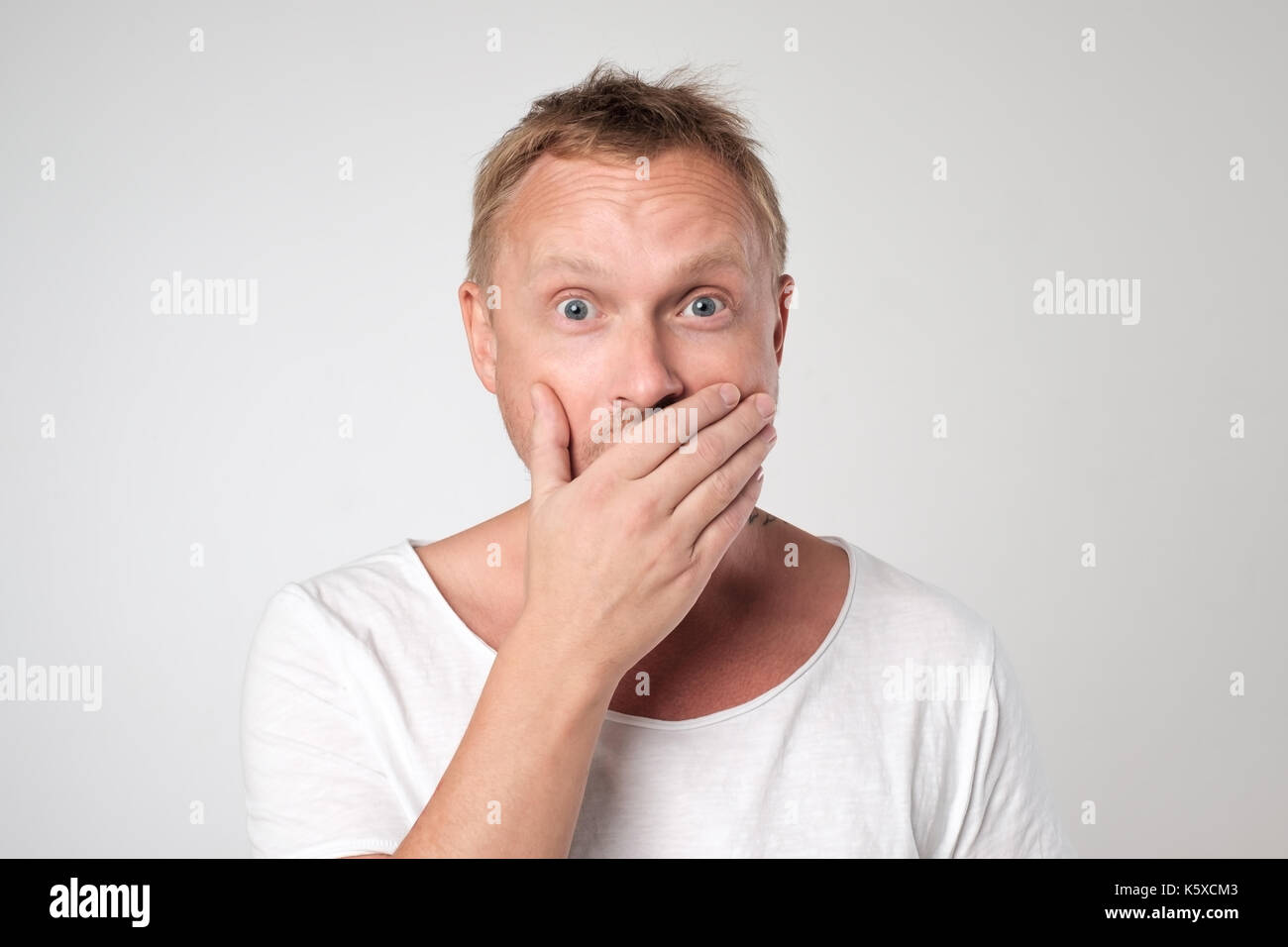 Holding finger to lips hi-res stock photography and images - Alamy