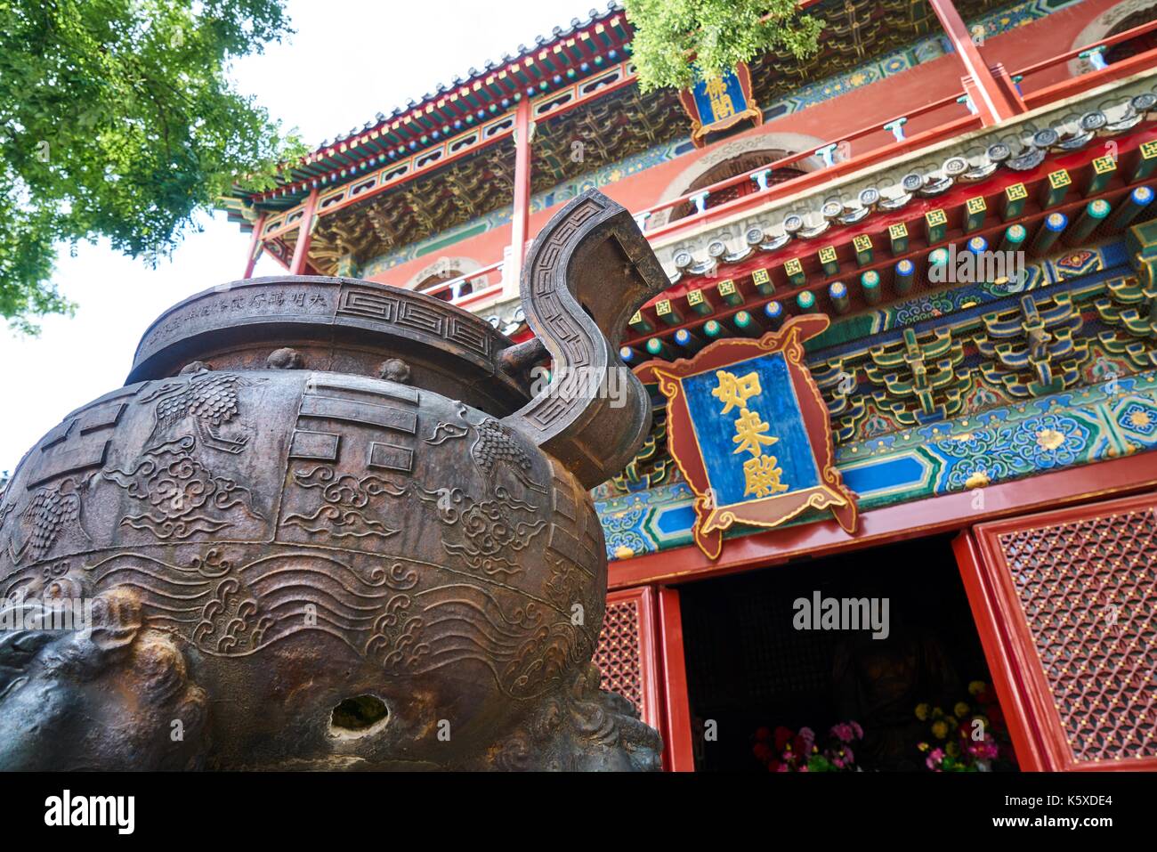 traditional buddhist red hall and incense burner in Zhihua temple in ...