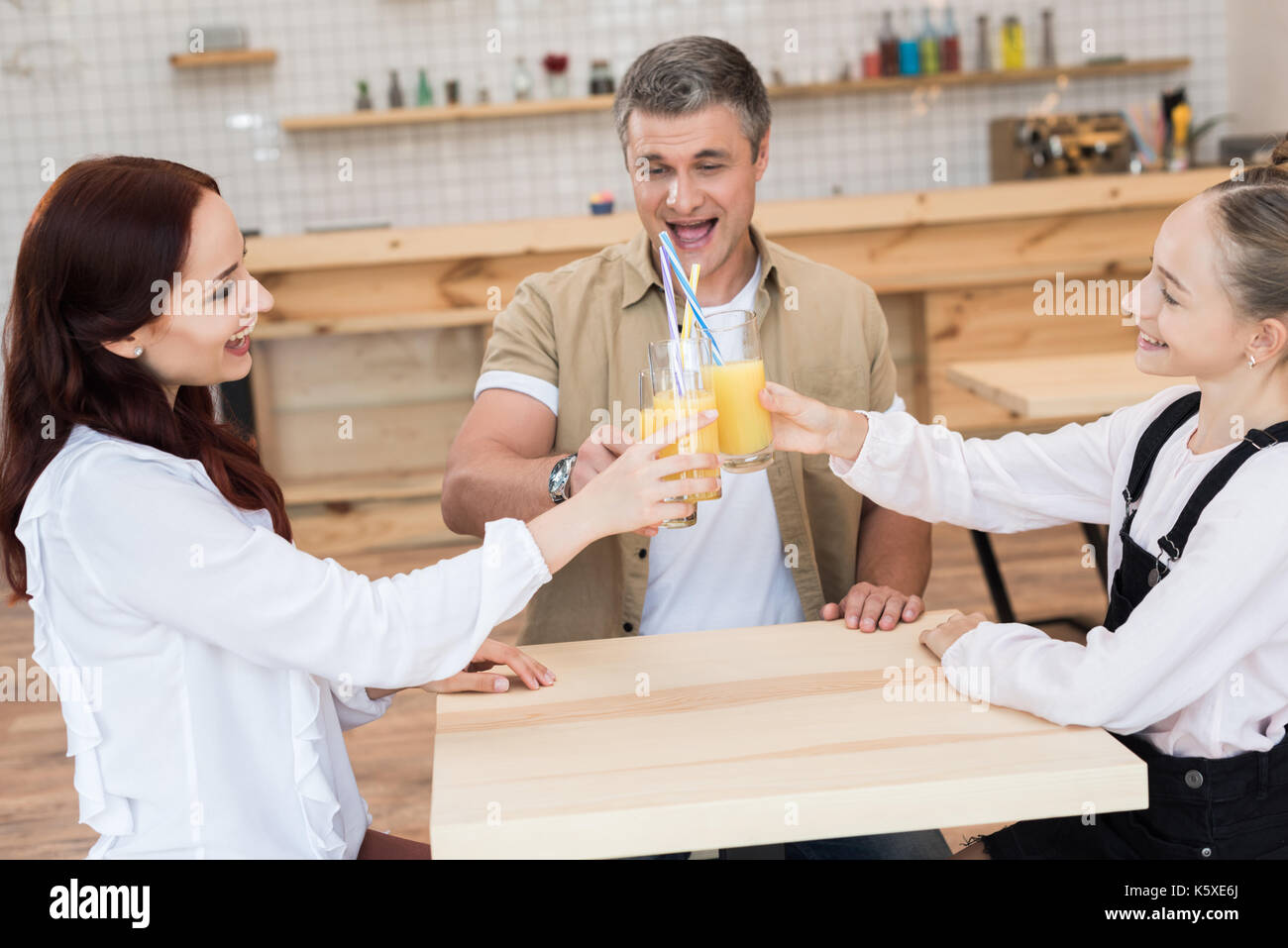 beautiful family in cafe Stock Photo - Alamy