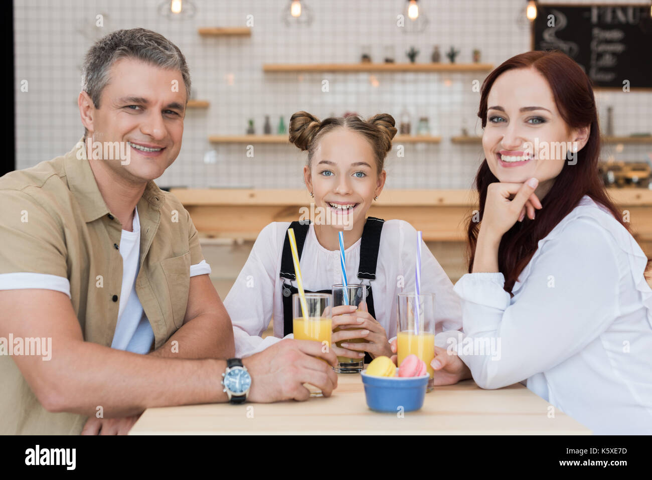 beautiful family in cafe Stock Photo - Alamy