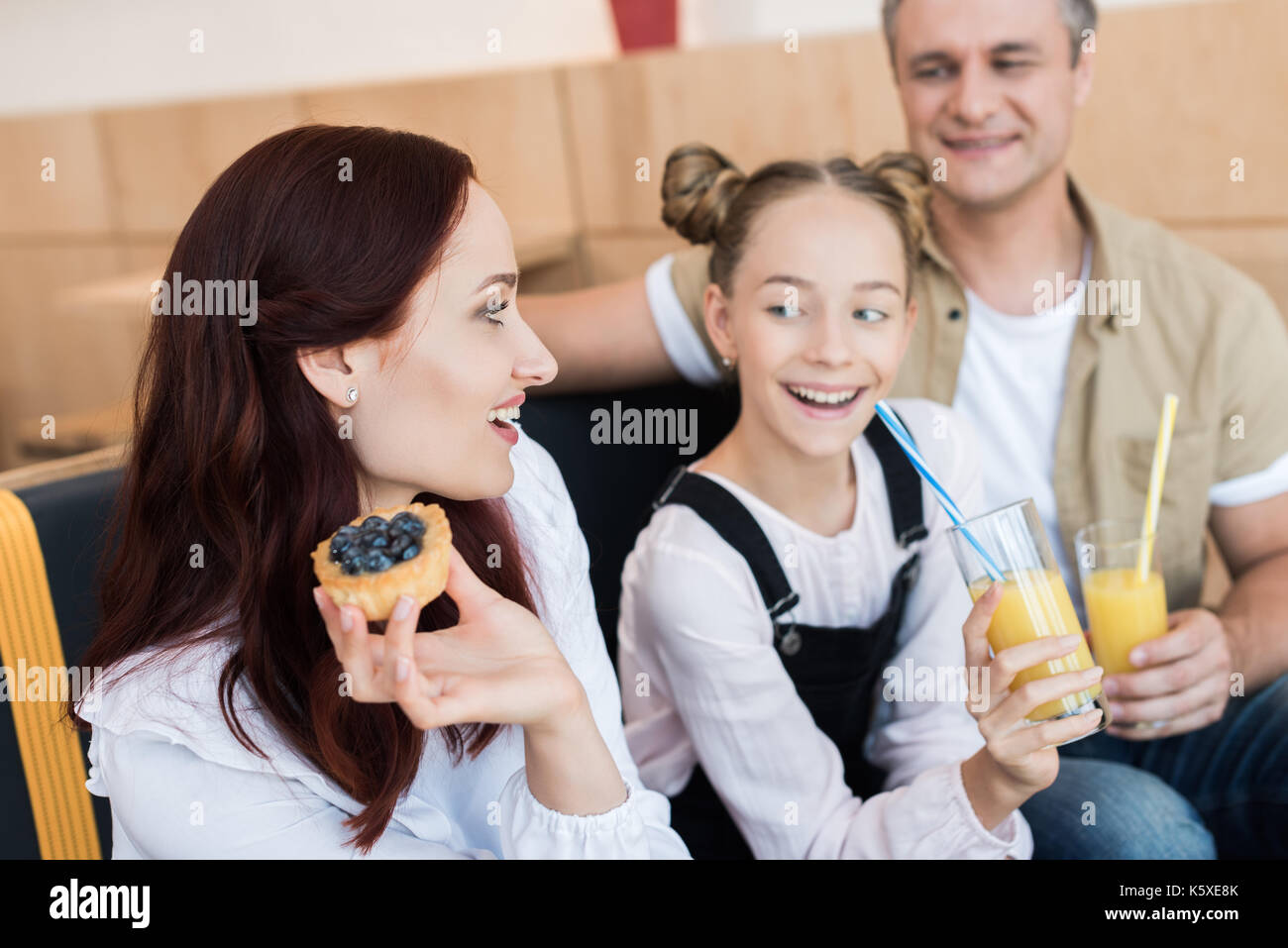 beautiful family in cafe Stock Photo - Alamy