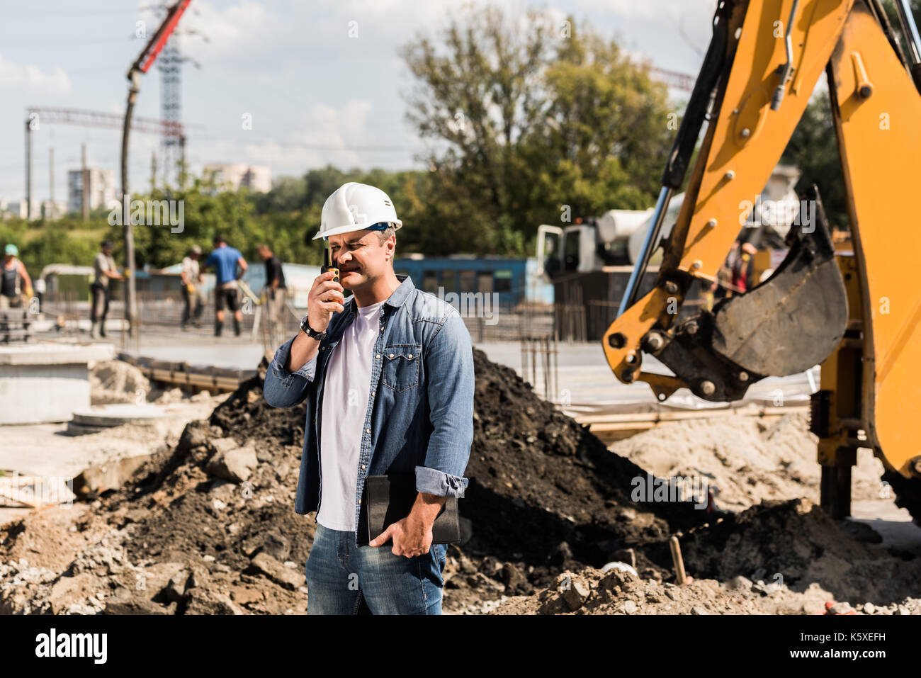 Construction Worker With Walkie Talkie Stock Photo Alamy