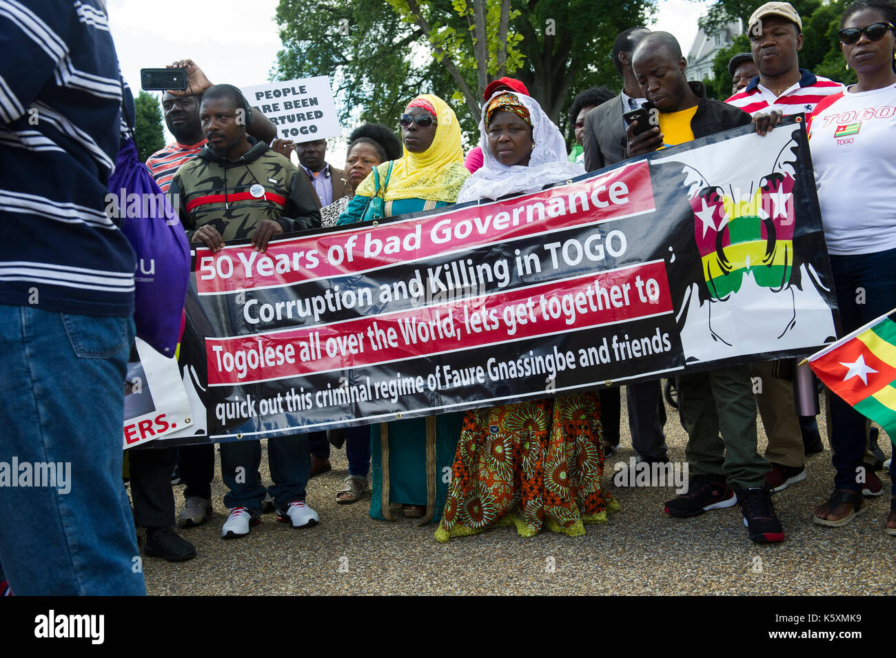 Protester seen holding a banner at the front of the demonstration. A ...
