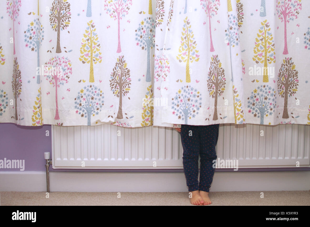 Child hiding behind curtain hi-res stock photography and images - Alamy
