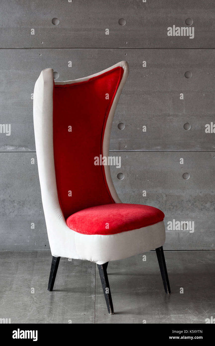 modern red chair and concrete wall. copy space Stock Photo - Alamy