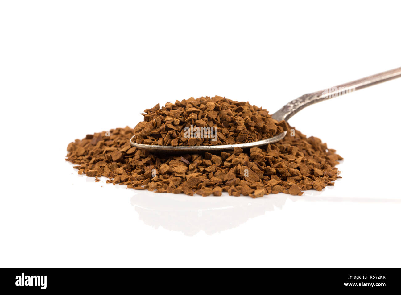 Heap of instant coffee in spoon isolated on white background Stock ...