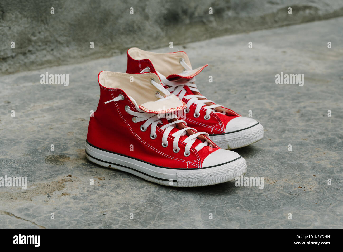 Running red shoes hi-res stock photography and images - Alamy