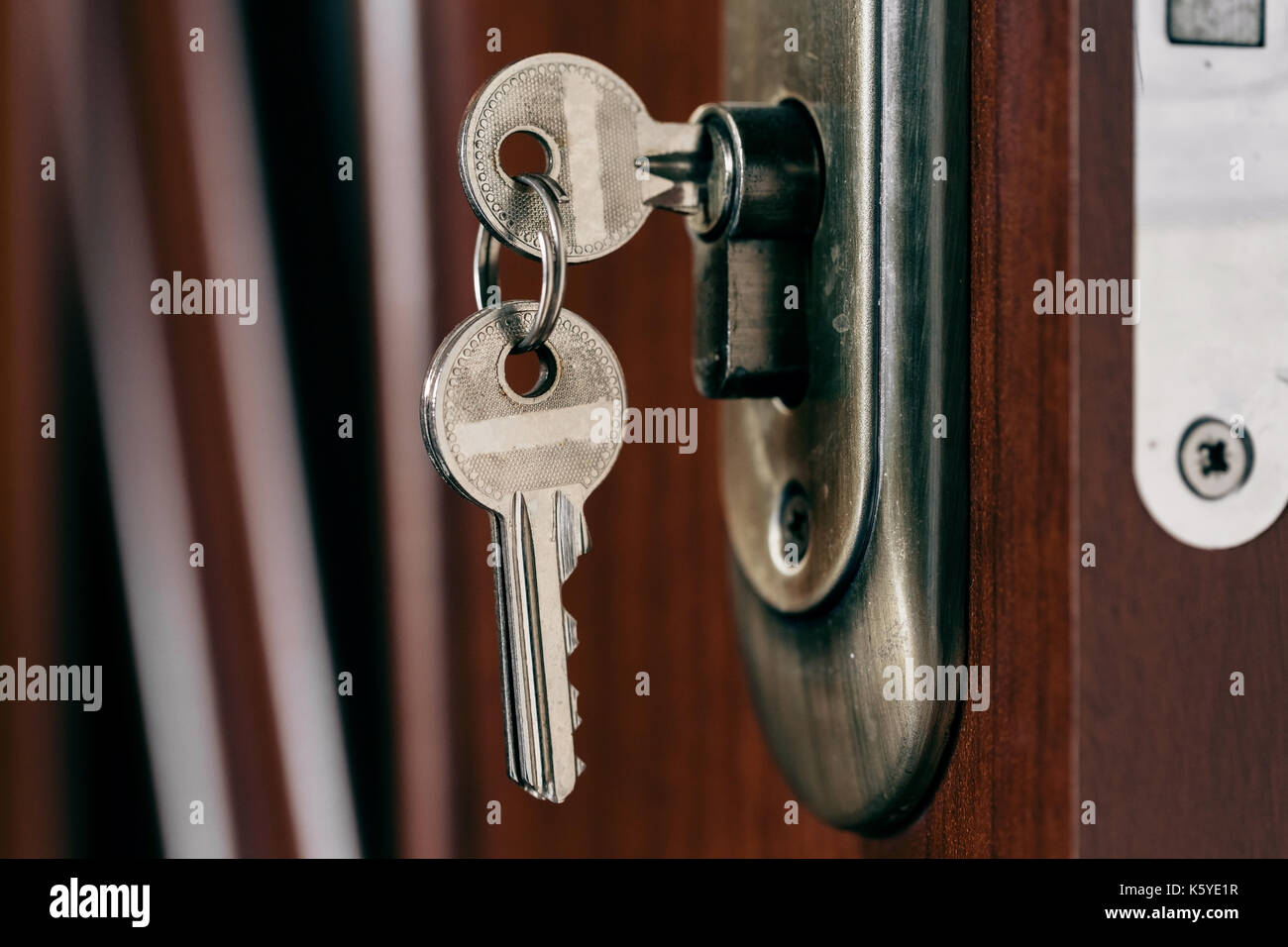 Keys in the door lock. Object photo Stock Photo - Alamy