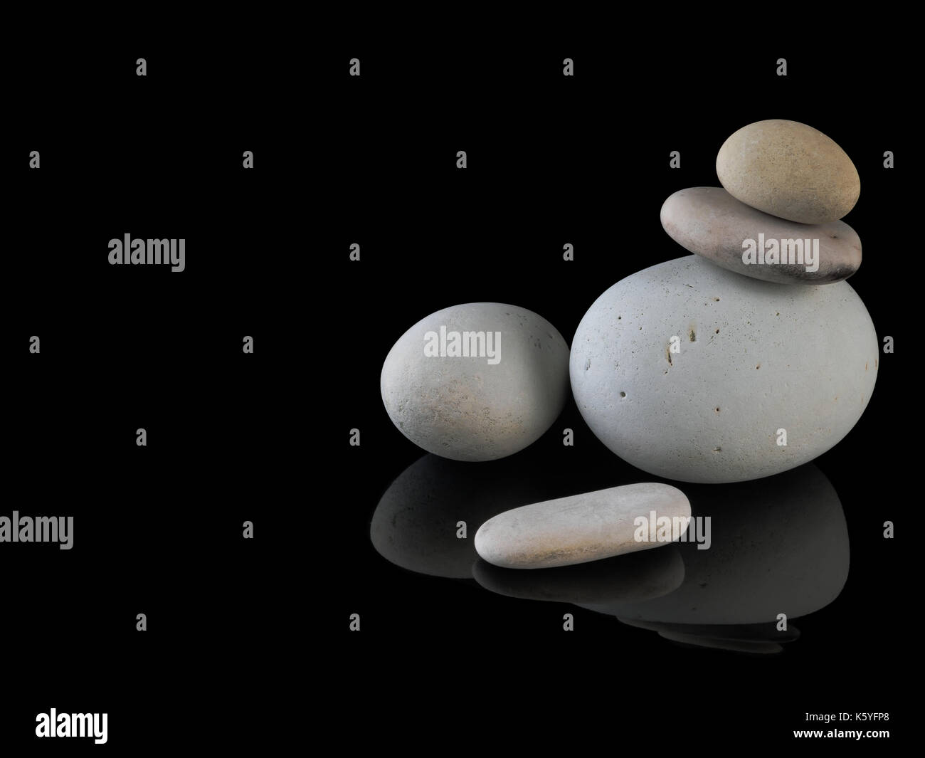 Zen stones rocks spa in stack mindfulness Stock Photo - Alamy