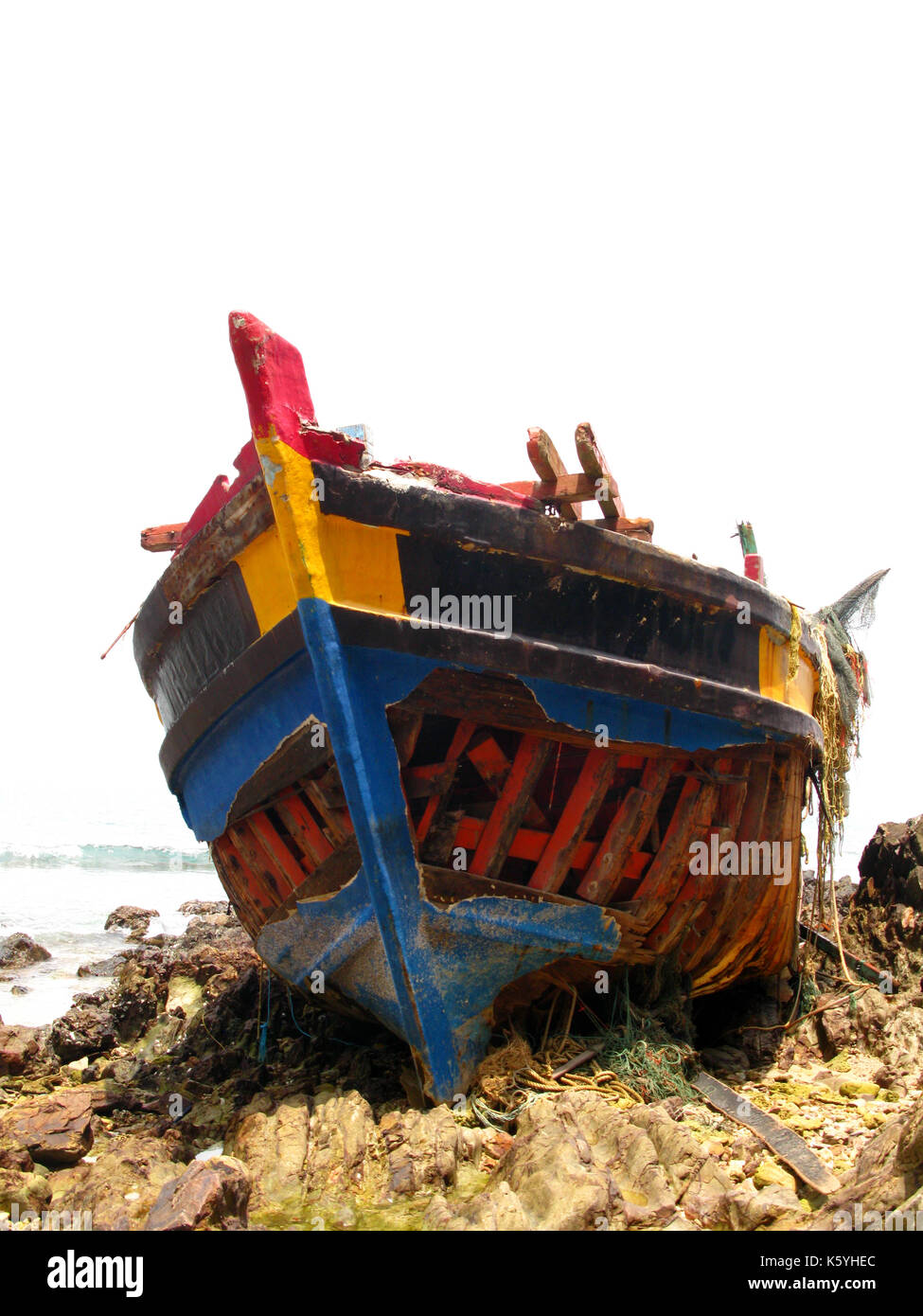 Wrecked and abandoned fishing boat washed up on the rocks Stock Photo ...