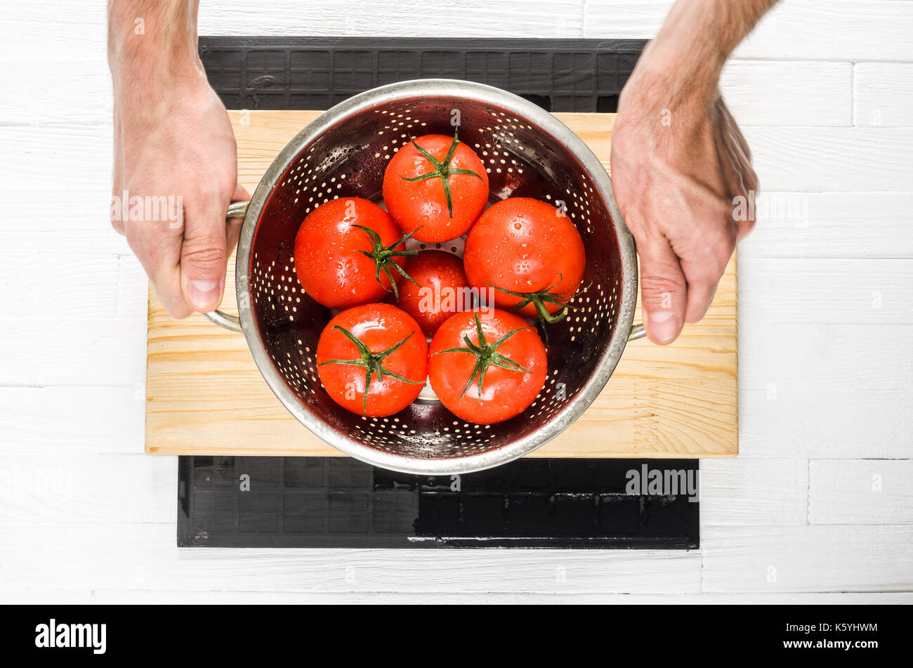 Stainless Steel Colander with Wet Tomatoes in a Chefs Hands After ...