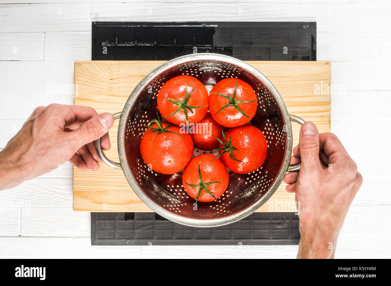 Stainless Steel Colander with Wet Tomatoes in a Chefs Hands After ...