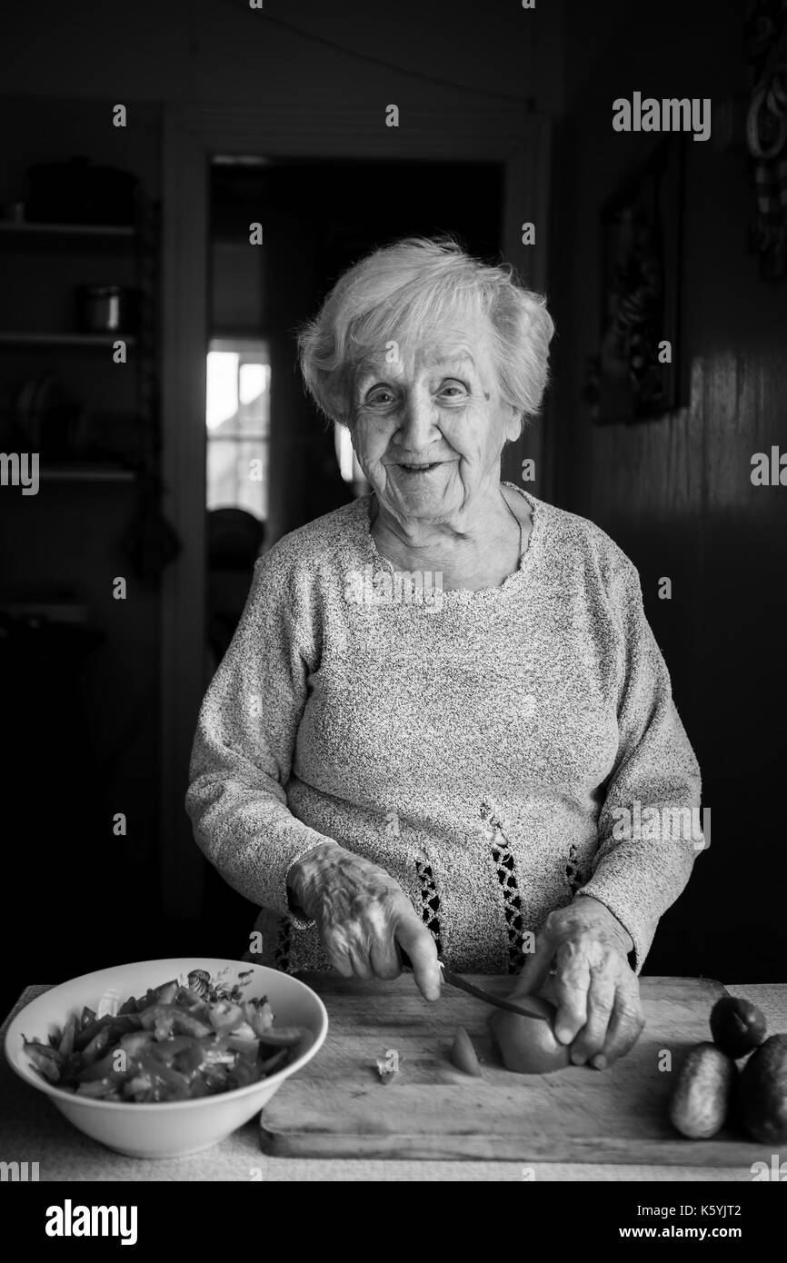 Old lady cooking Black and White Stock Photos & Images - Alamy