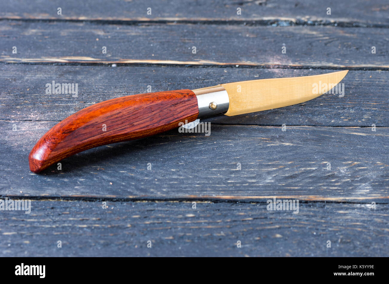 The knife is located diagonally in the center of the frame. Pocket ...