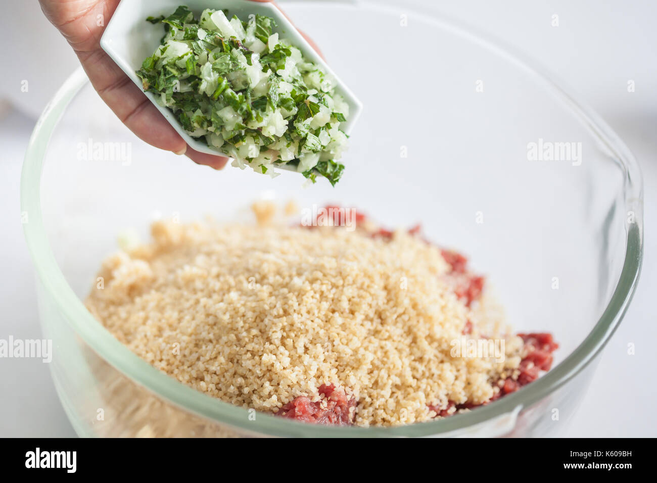 Step by step Levantine cuisine kibbeh preparation : Adding the ...