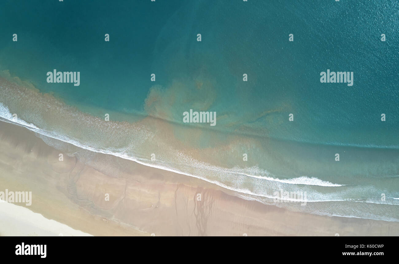 Beach with blue water above aerial view Stock Photo - Alamy