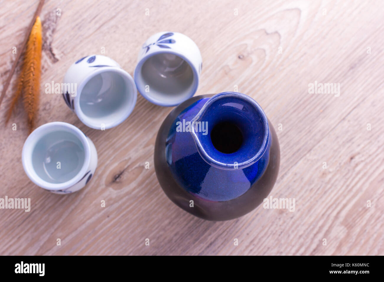 Japanese Sake drinking set on old wood texture background (focus on ...