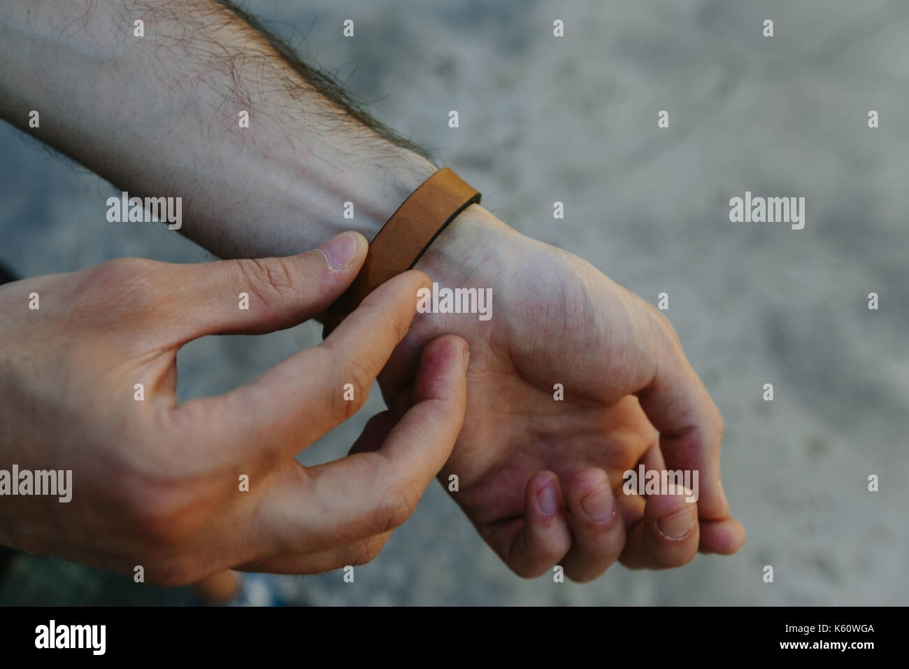 Leather strap on the arm Stock Photo - Alamy