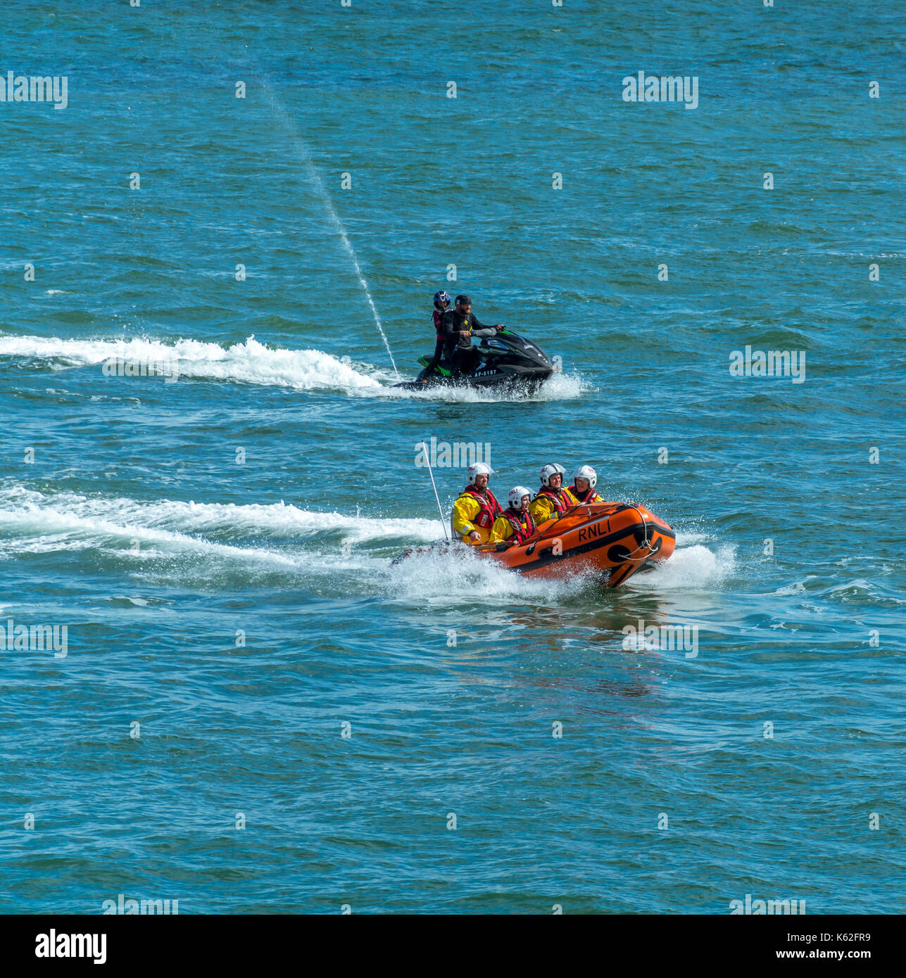 The inshore lifeboat races around the bay at Moelfre Lifeboat Day 2017 ...