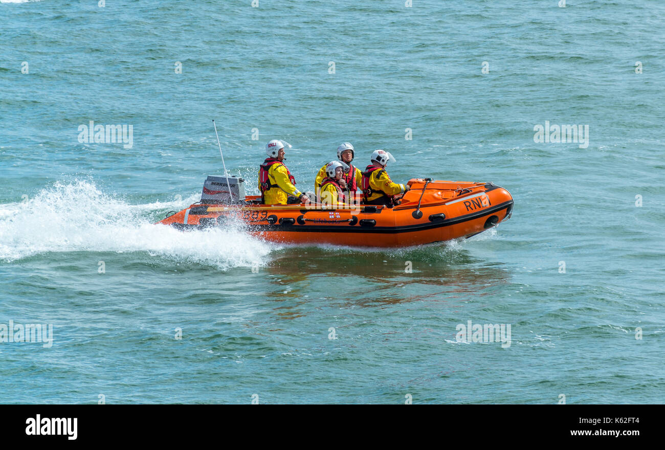 The inshore lifeboat races around the bay at Moelfre Lifeboat Day 2017 ...